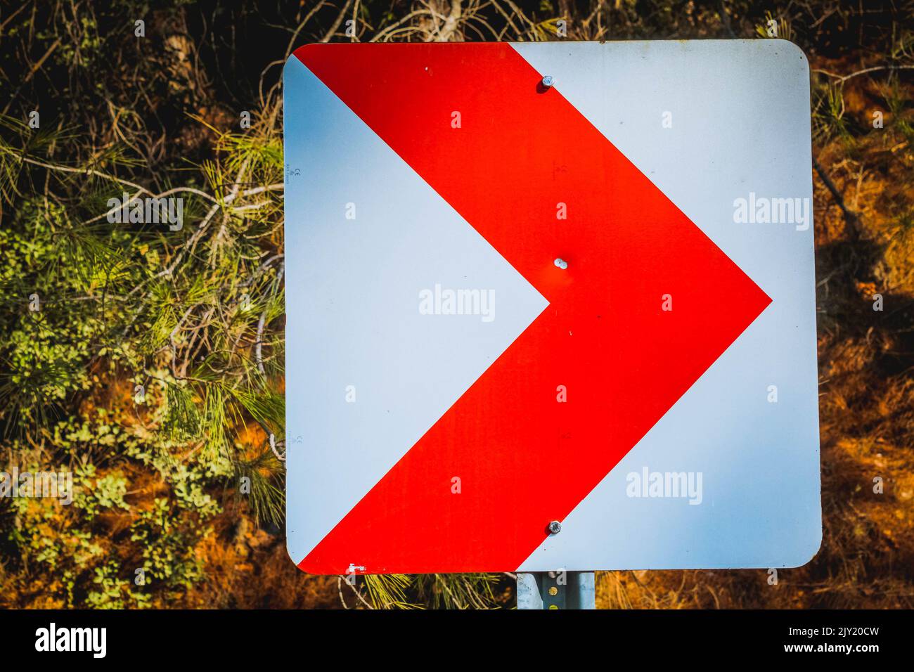Right signpost on the road, traffic sign, white sign on the red ...