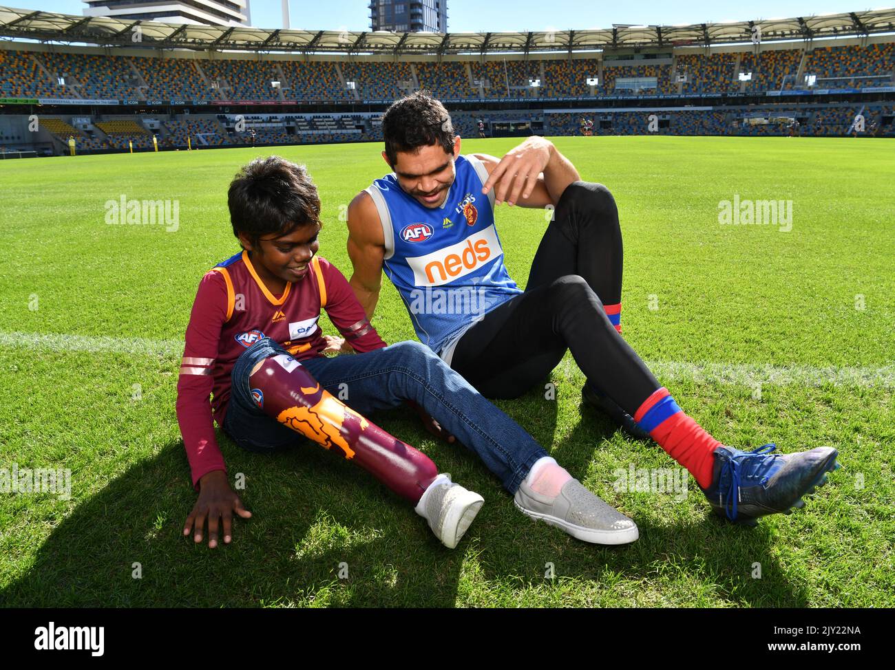 Shericka Mahoney (left) is seen with Lions player Charlie Cameron ...