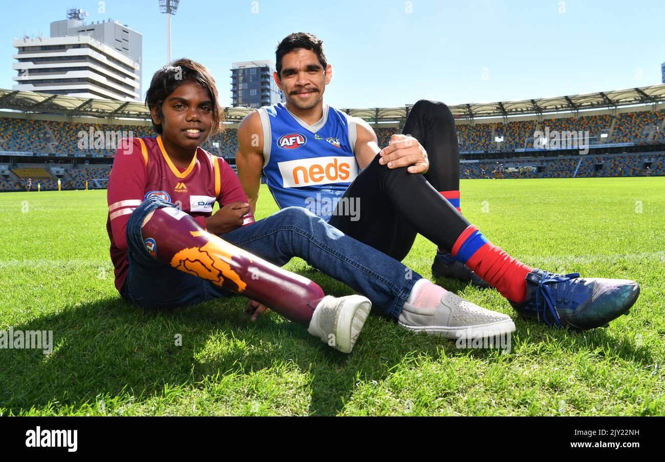 Shericka Mahoney (left) is seen with Lions player Charlie Cameron ...