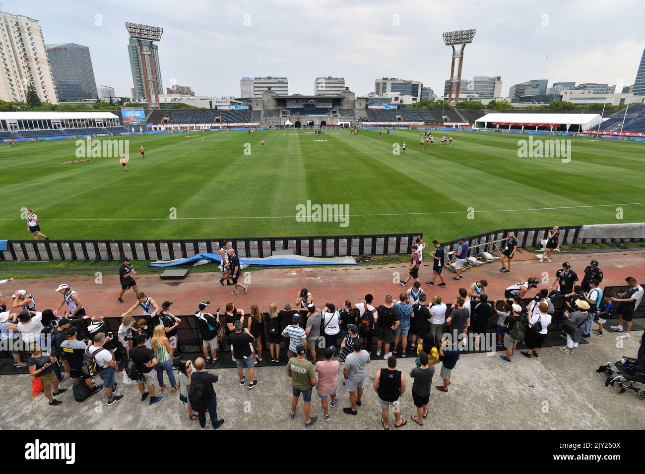 Power players are seen signing autographs during a training session at ...