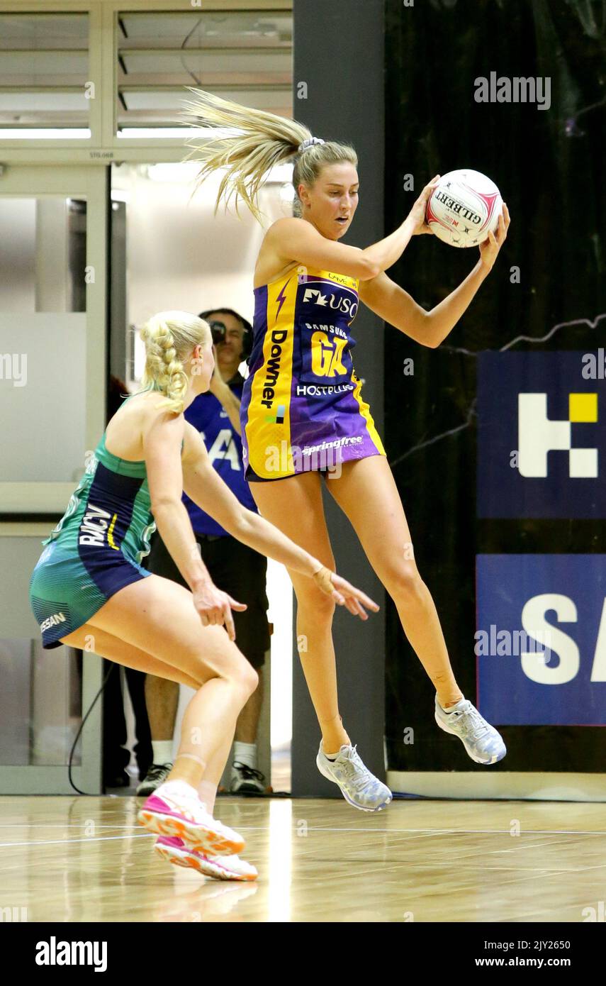 Cara Koenen of the Lightning with the ball against Jo Weston of the ...