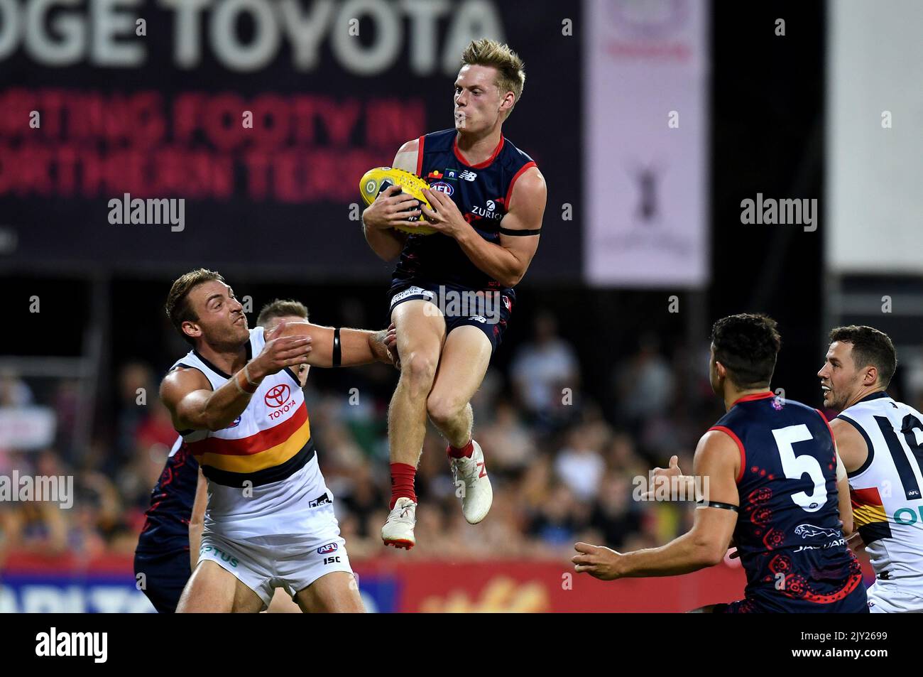 Charlie Spargo of the Demons (centre) takes a mark during the Round 11 ...