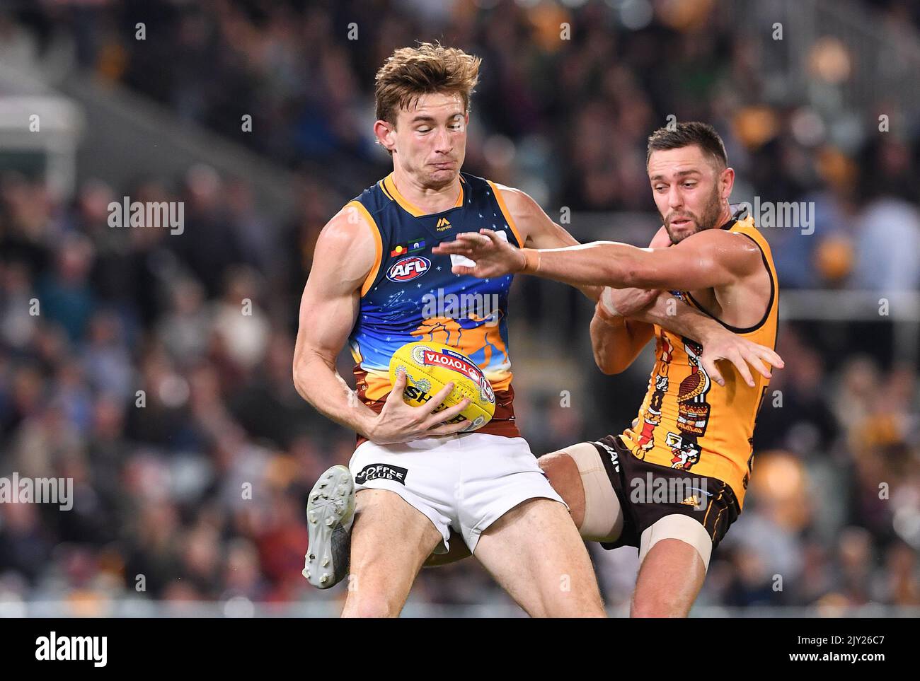 Harris Andrews of the Lions takes a one handed mark in front of Jack ...
