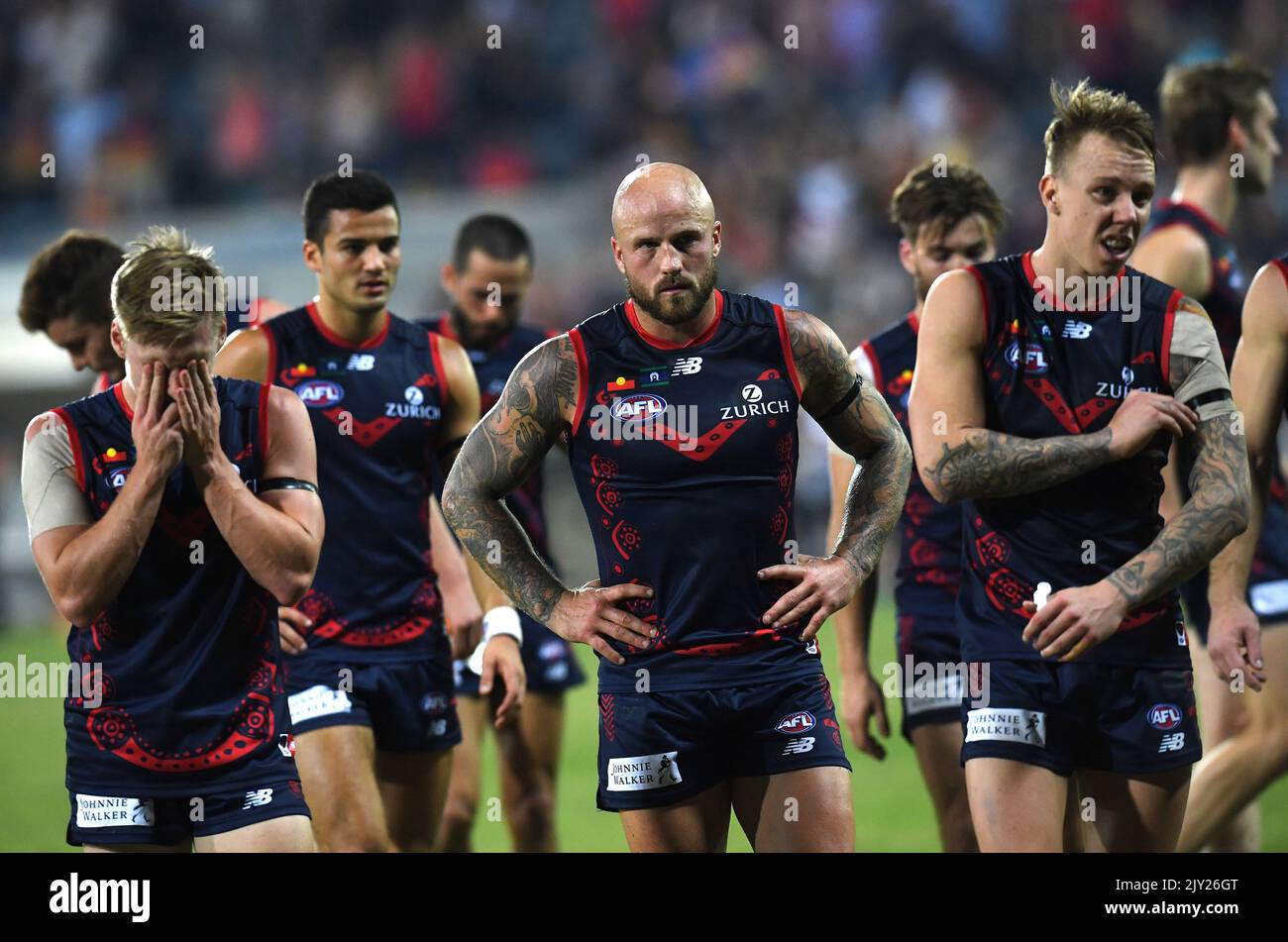 Melbourne Demons players react after losing the Round 11 AFL match ...