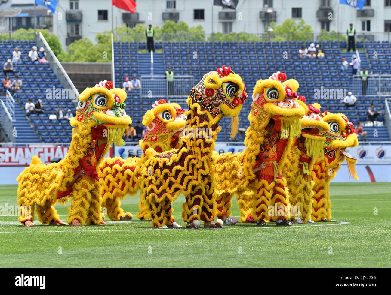 Chinese performers are seen before the start of the Round 11 AFL match ...