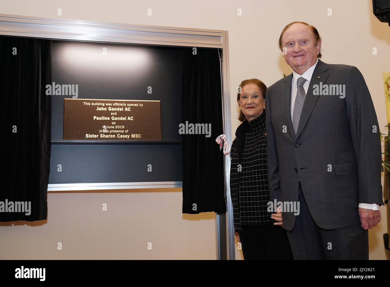 John Gandel and his wife Pauline pose next to the plaque during the ...