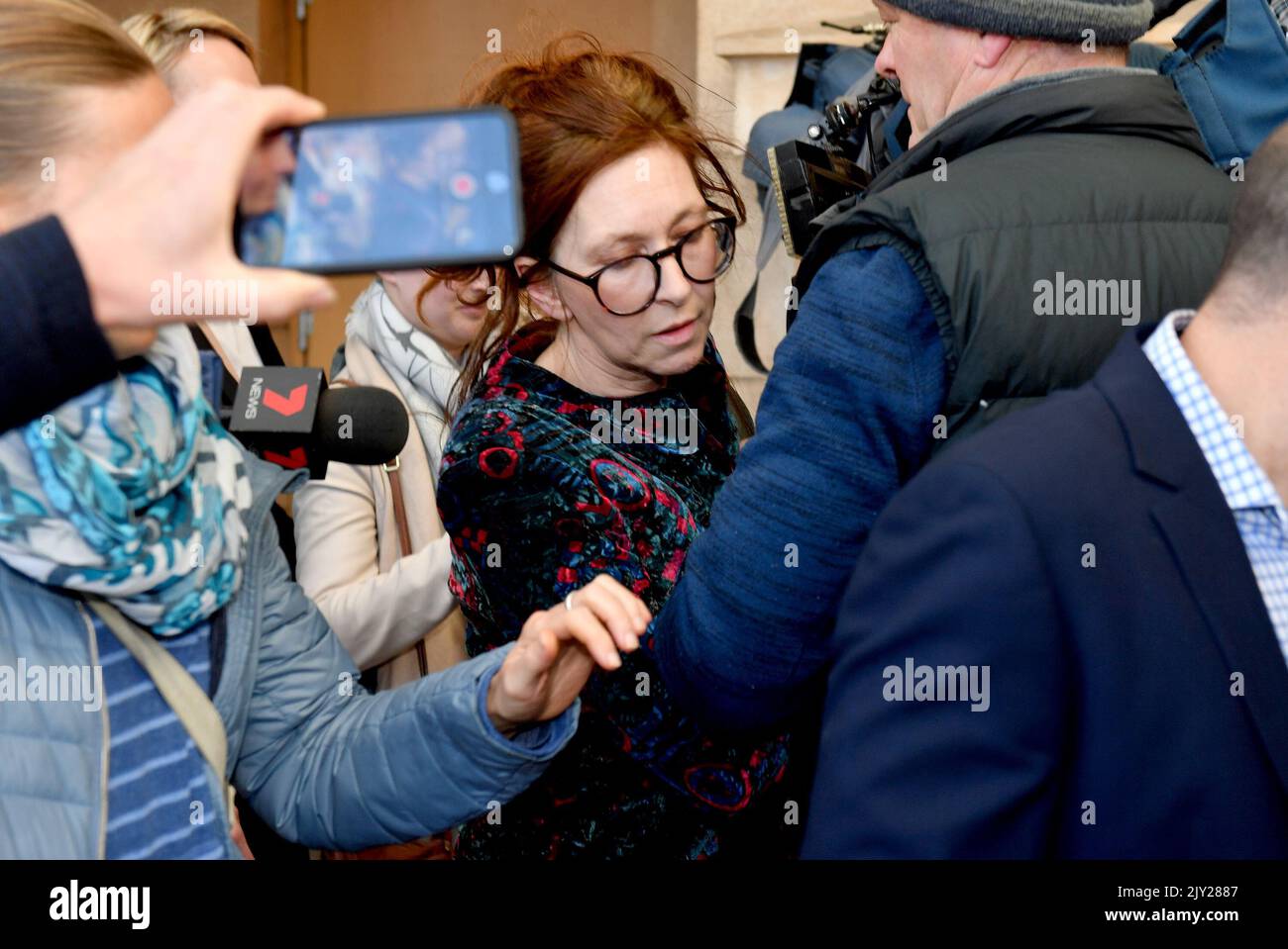 Former midwife Lisa Barrett departs the Supreme Court in Adelaide ...