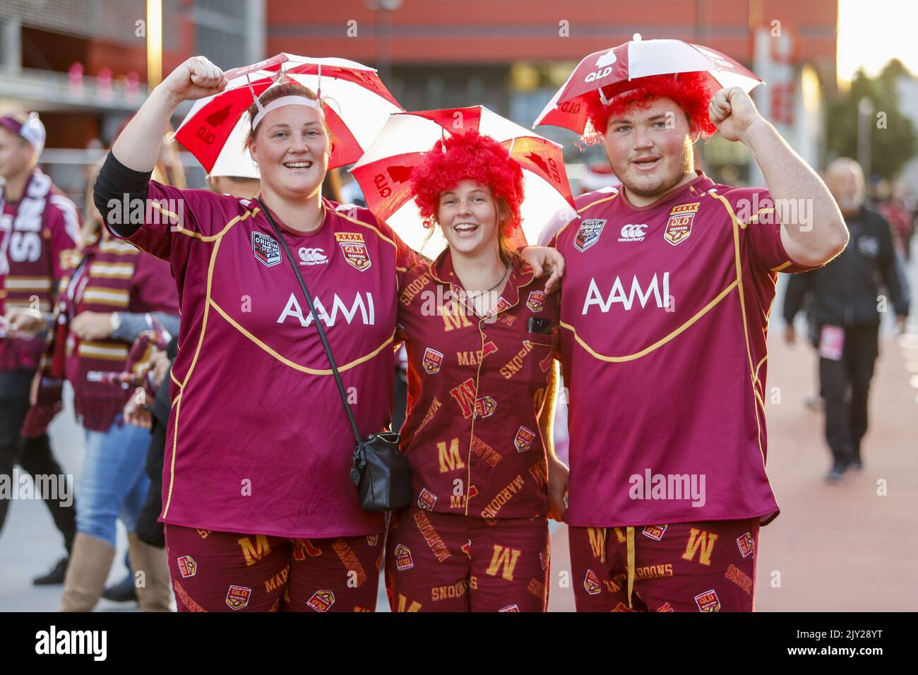 (L-R) Qld Maroons fans Brittany Holding, Meg Hansen and Conan Holding ...