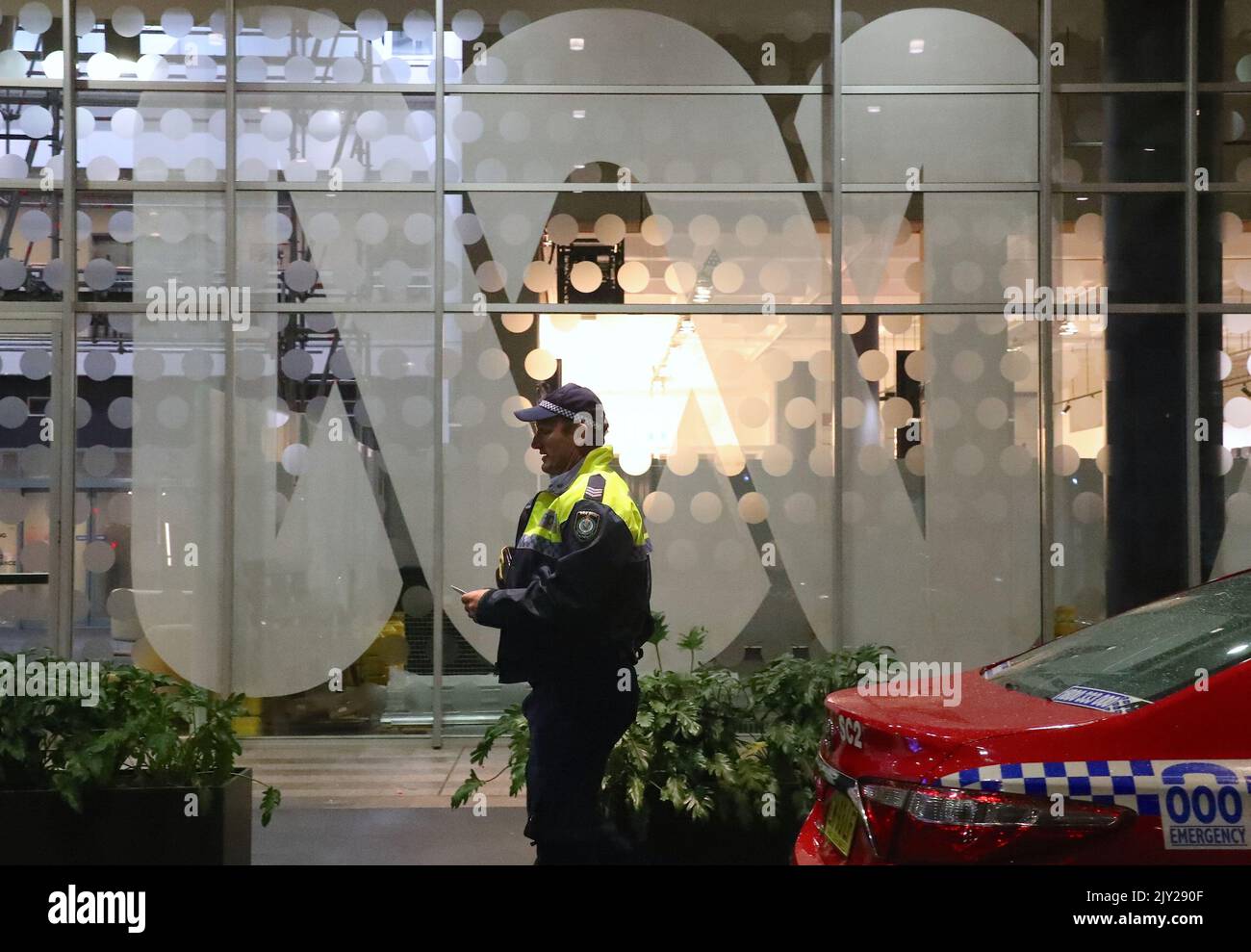 A policeman walks past the ABC logo at the main entrance to the ABC ...