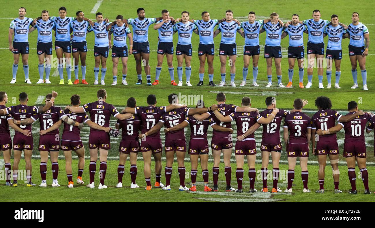 QLD Maroons and NSW Blues players line up for the National Anthem ...