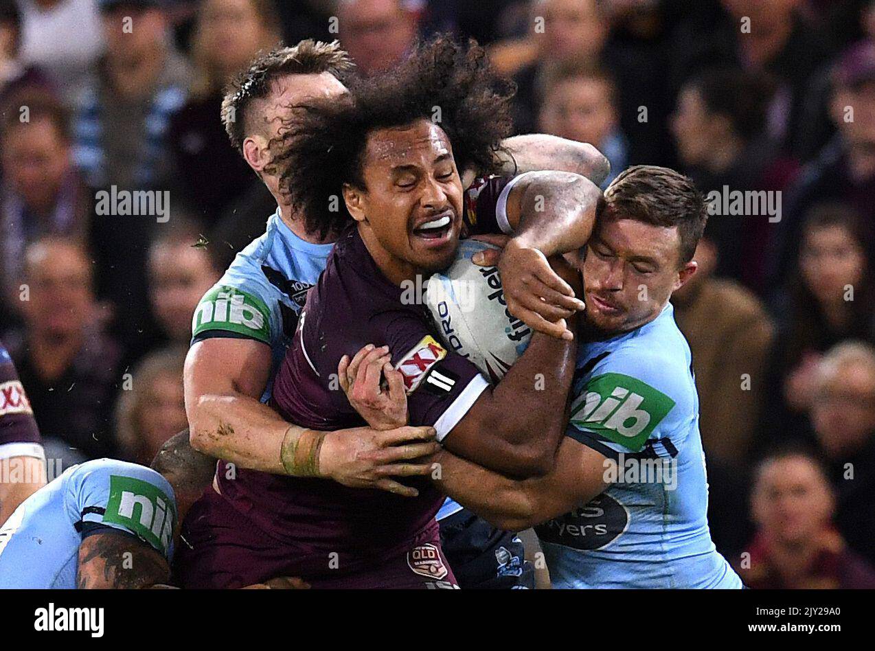 Felise Kaufusi of the Maroons (centre) is tackled during Game 1 of the ...