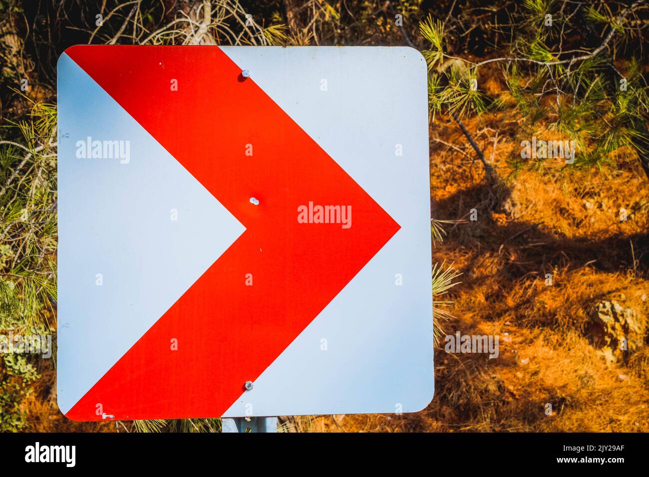 Right signpost on the road, traffic sign, white sign on the red ...