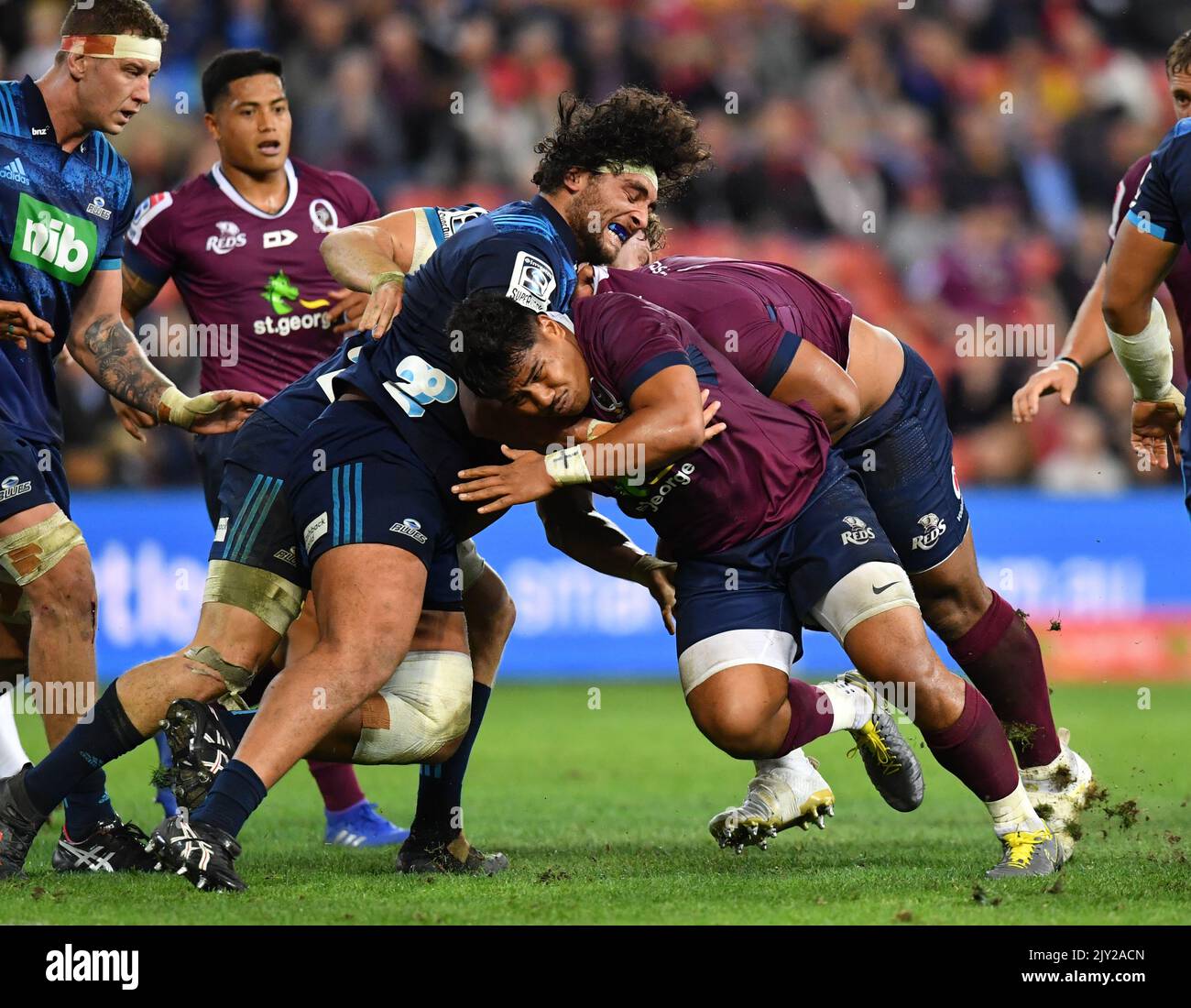 Alex Mafi (centre) of the Reds in action during the Round 17 Super ...
