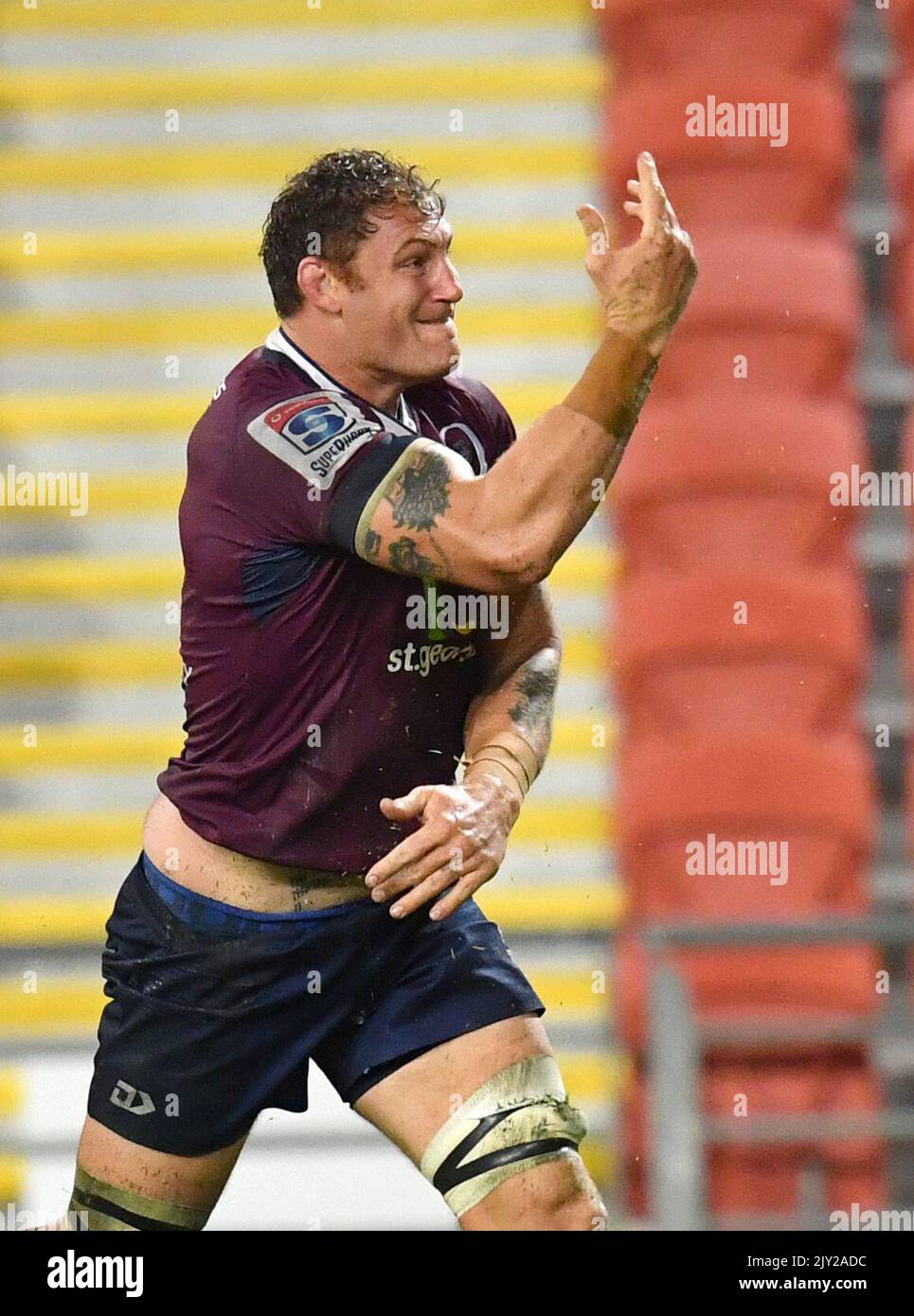 Scott Higginbotham of the Reds celebrates scoring a try during the ...