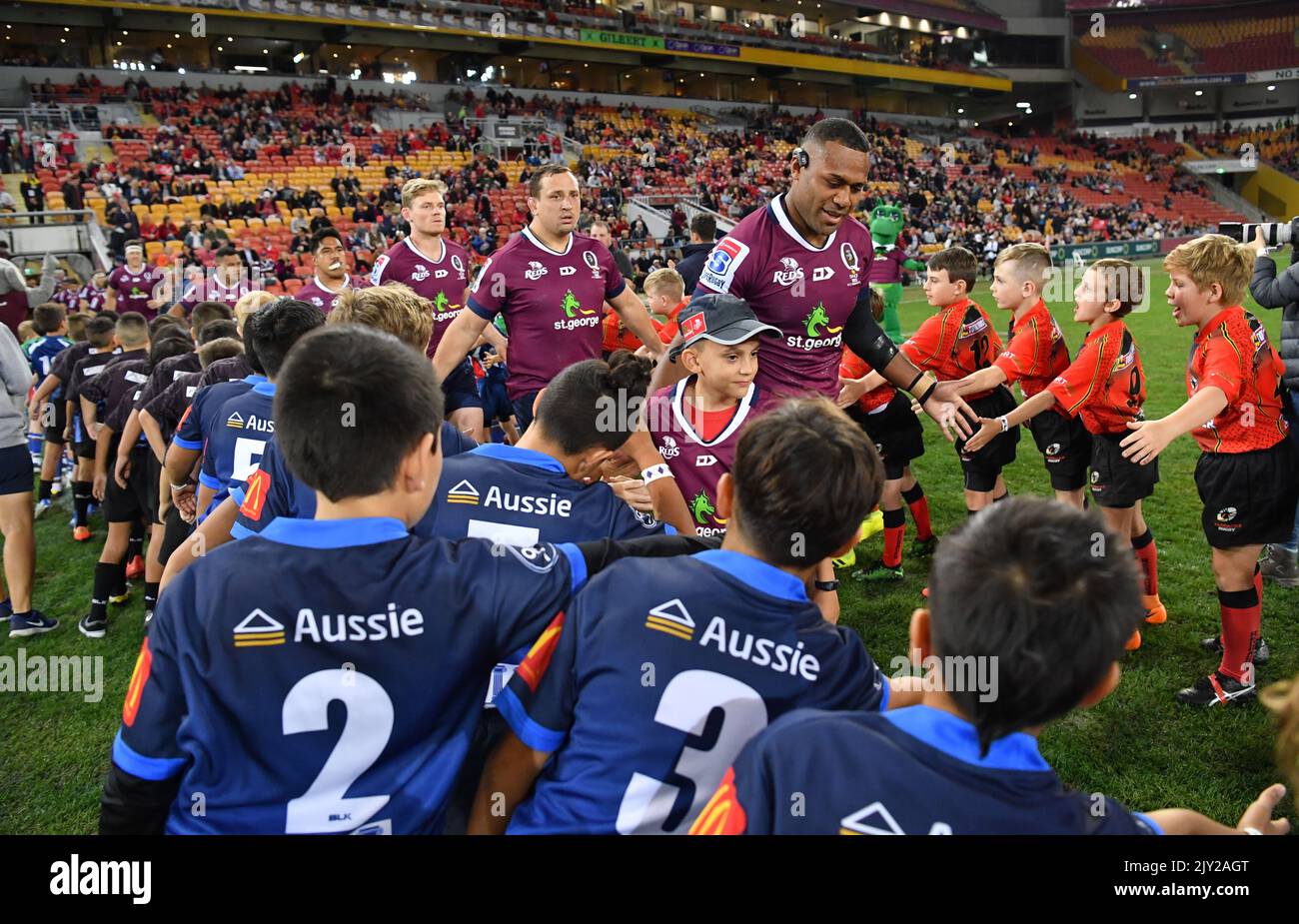 Reds captain Samu Kerevi (right) leads his team onto the field before ...
