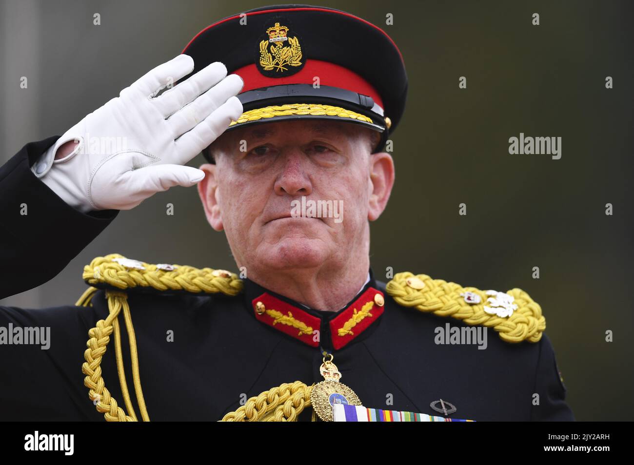 Australian Governor-General Sir Peter Cosgrove salutes during the ...