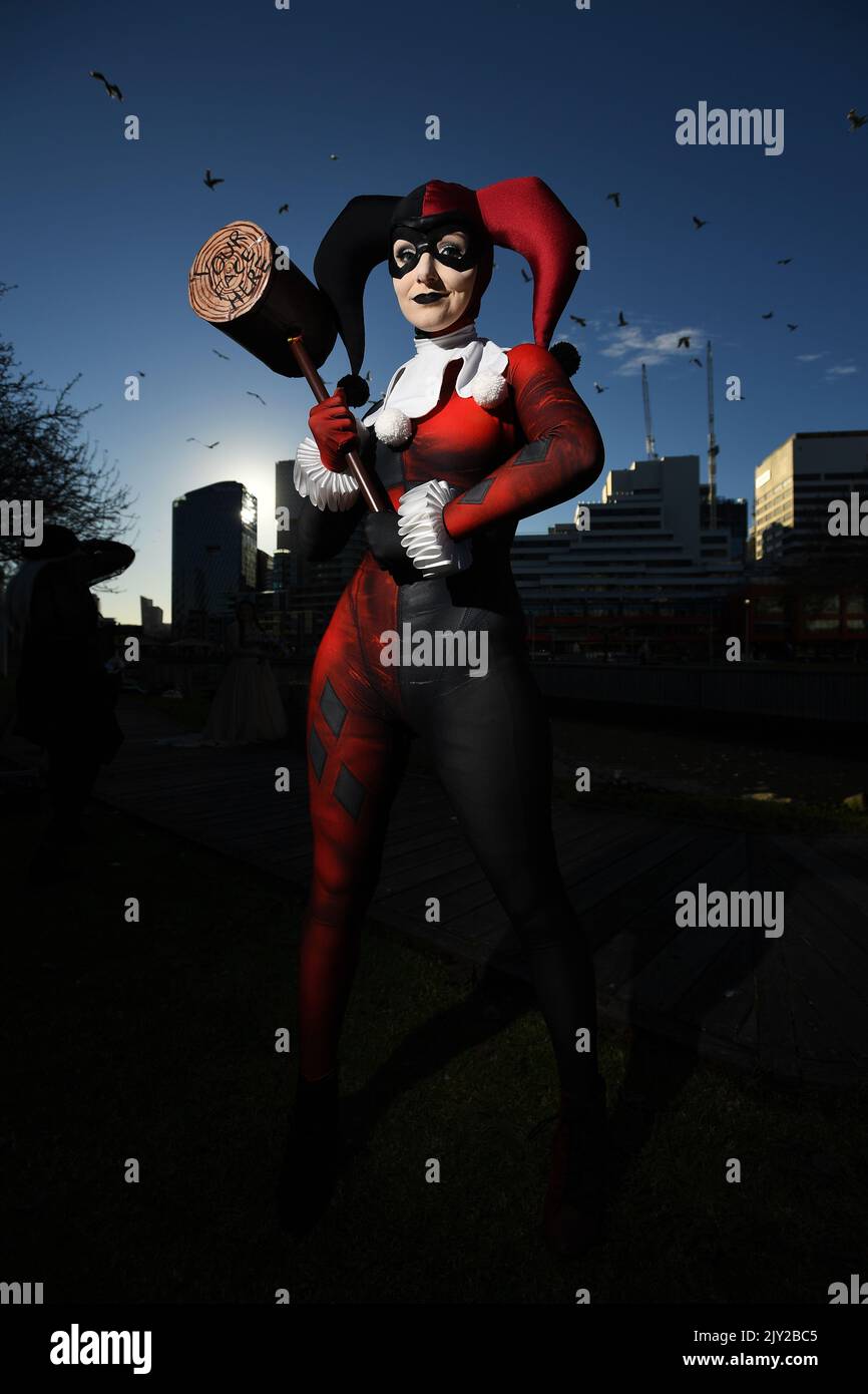 A cosplayer poses for a photograph at the Oz Comic-Con festival ...