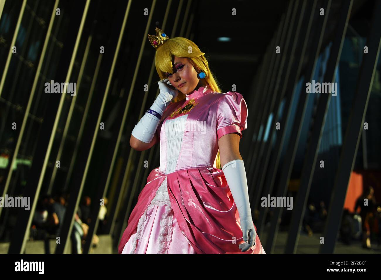 A cosplayer poses for a photograph at the Oz Comic-Con festival ...