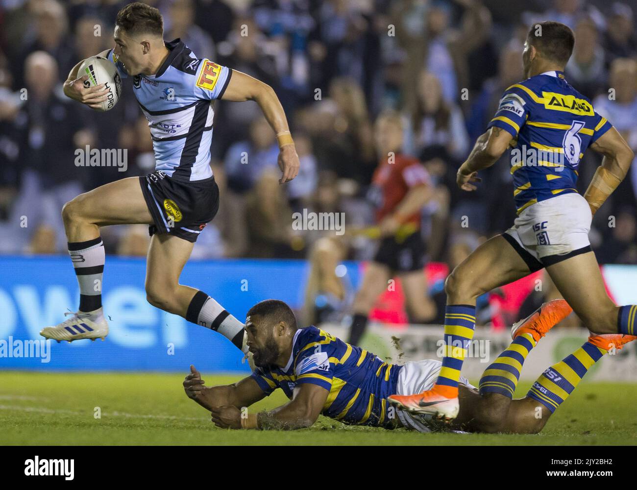 Kyle Flanagan of the Sharks scores during the Round 13 NRL match ...