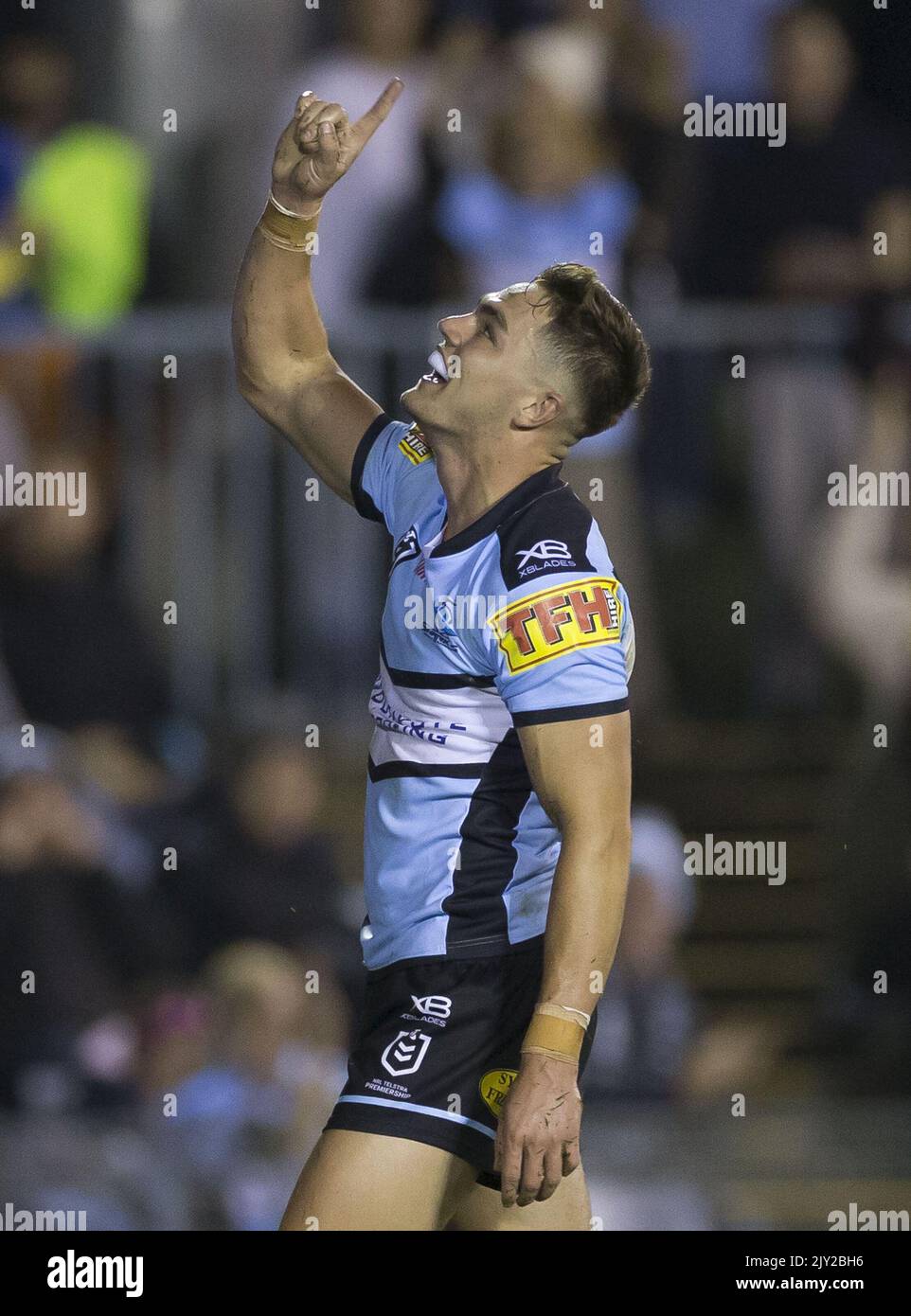Kyle Flanagan of the Sharks scores during the Round 13 NRL match ...