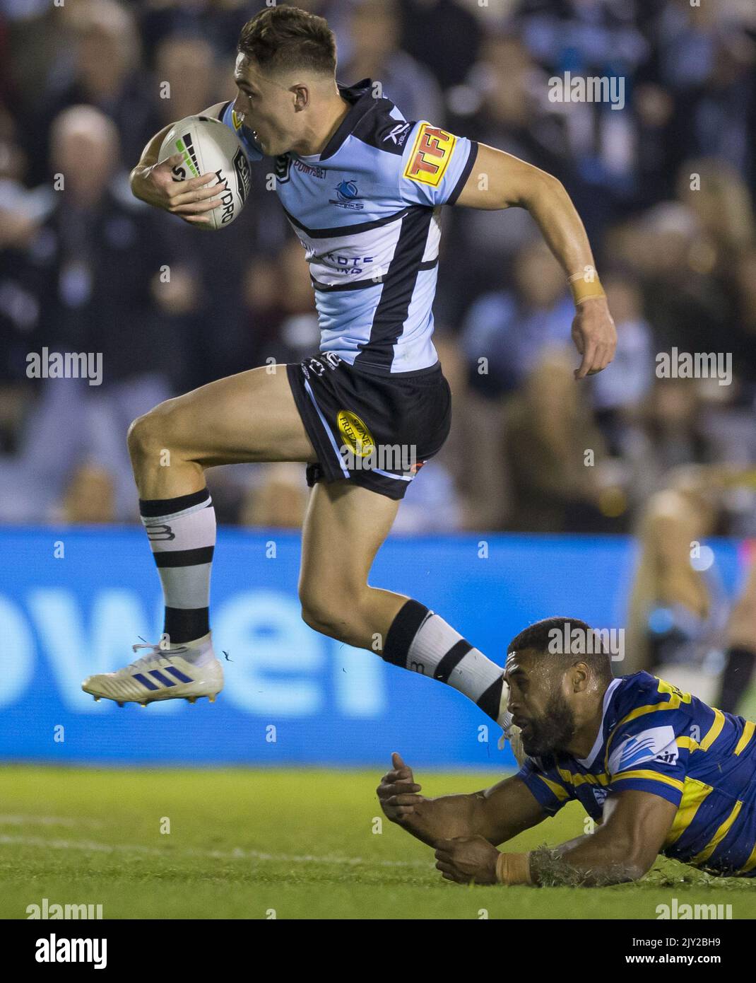 Kyle Flanagan of the Sharks scores during the Round 13 NRL match ...