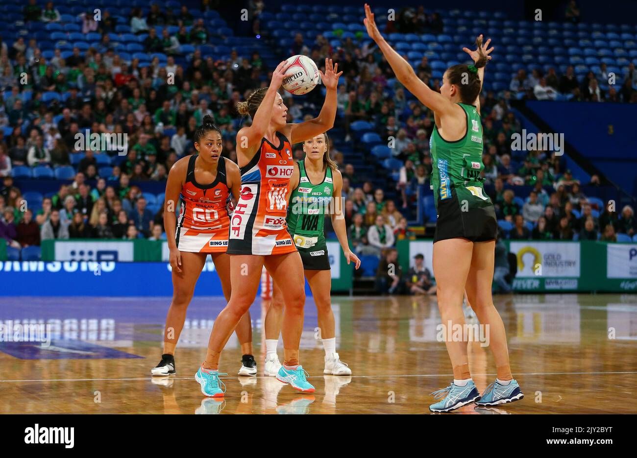 Kim Green of the Giants looks for a pass around Shannon Eagland of the ...