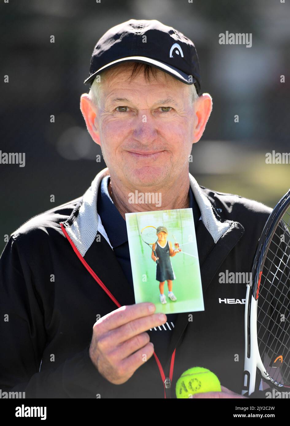 Jim Joyce, Ashleigh (Ash) Barty's first tennis coach, holds a photo of ...