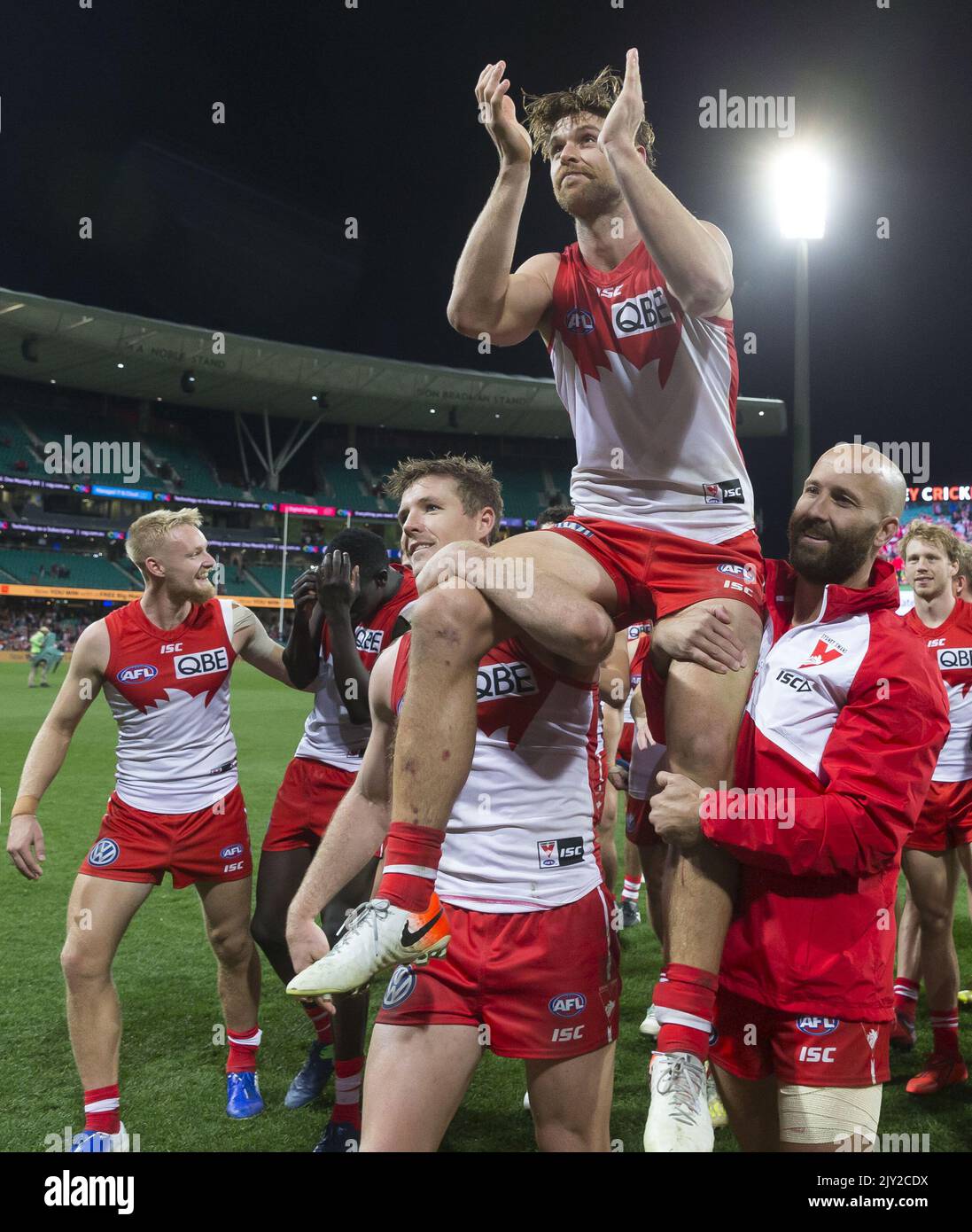 Dane Rampe of the Swans is chaired off after his 150th game during the ...