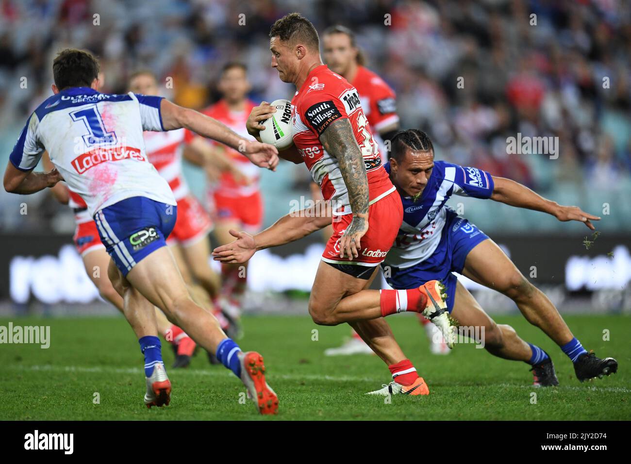 Tariq Sims of the Dragons beats Sauaso Sue of the Bulldogs during the ...