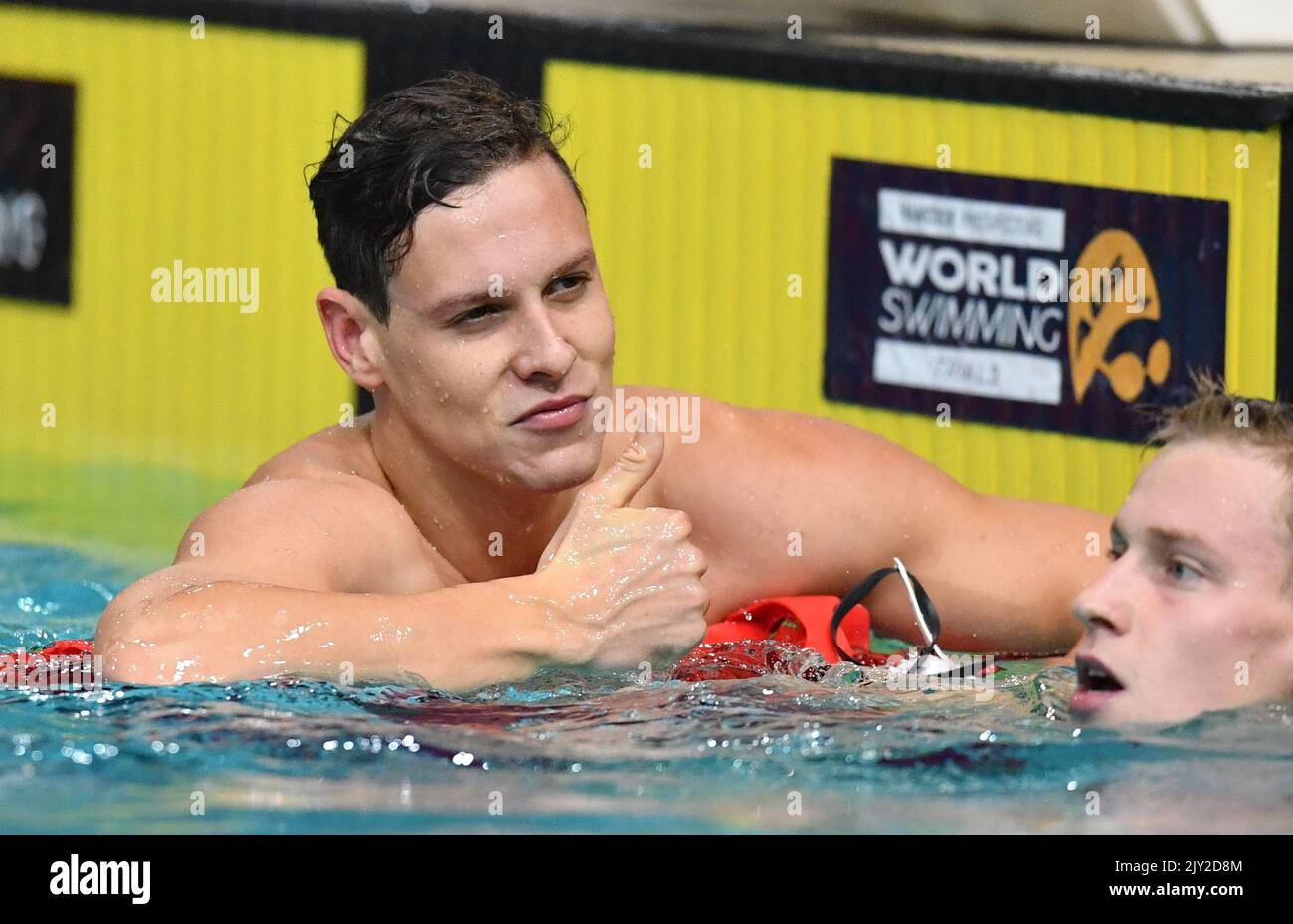 Australian swimmer Mitch Larkin (left) celebrates winning the final of ...