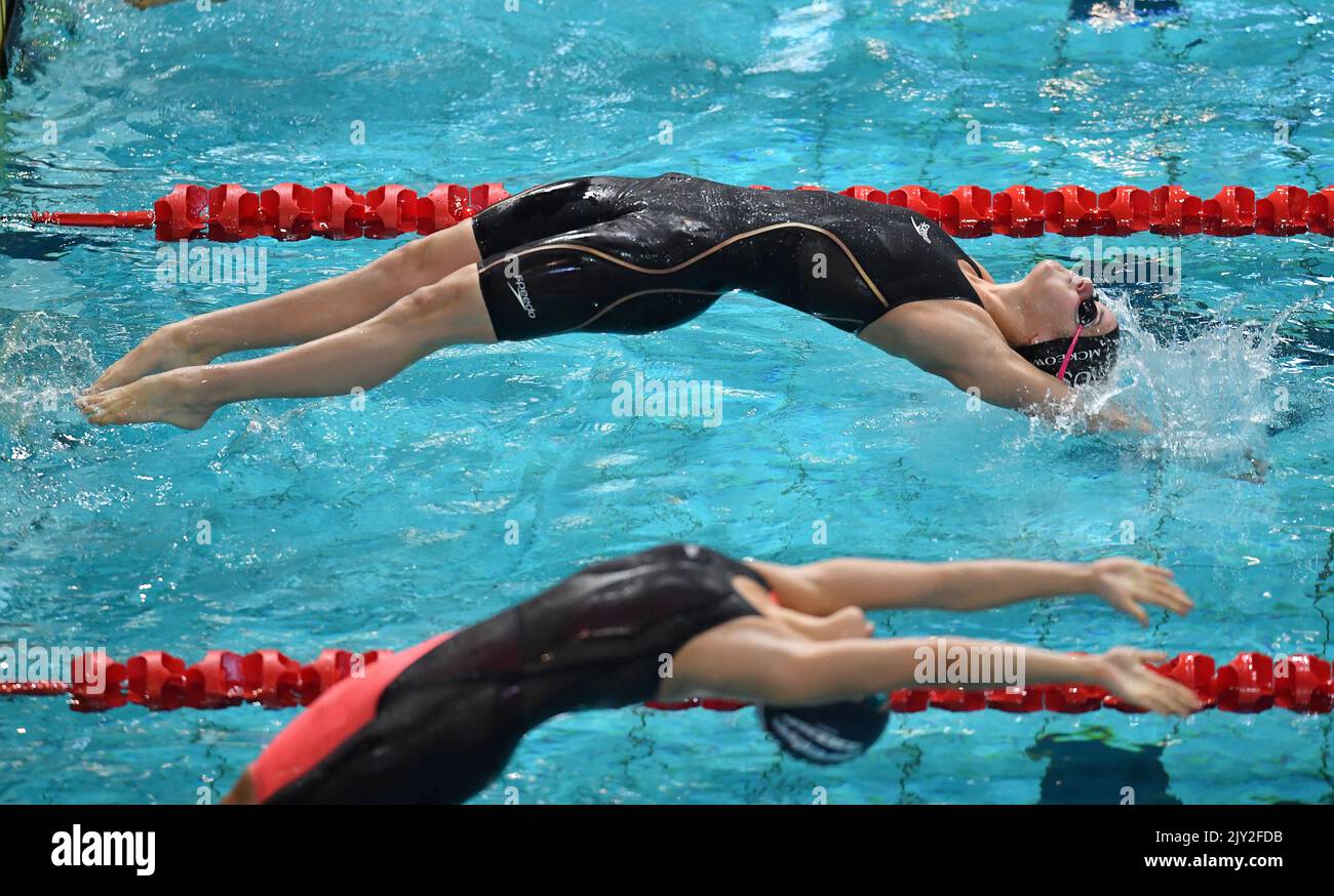Australian swimmer Kaylee McKeown (top) in action during the heats of ...