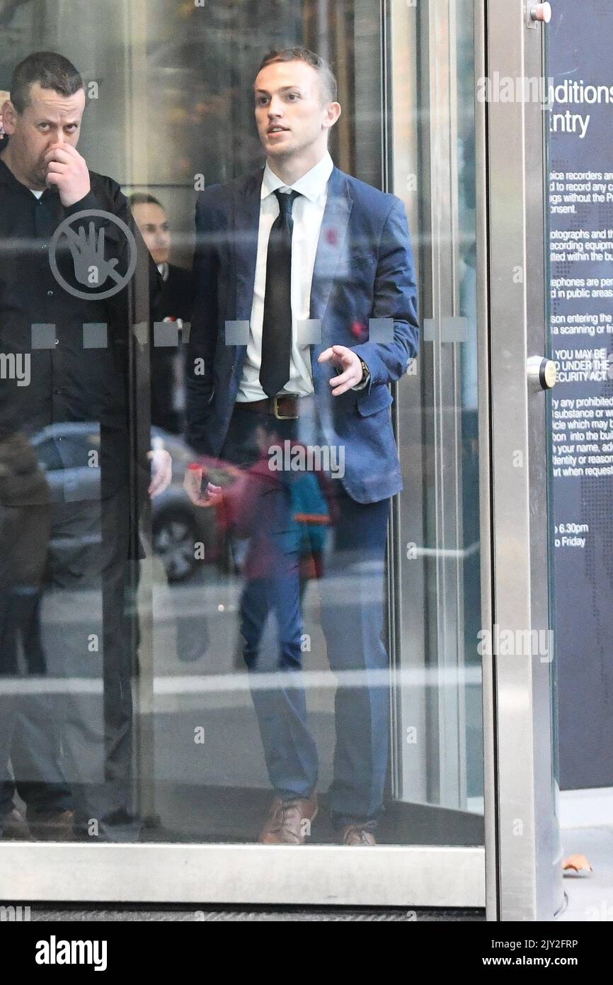 Joshua Lewis (right) departs the County Court of Victoria, Melbourne ...
