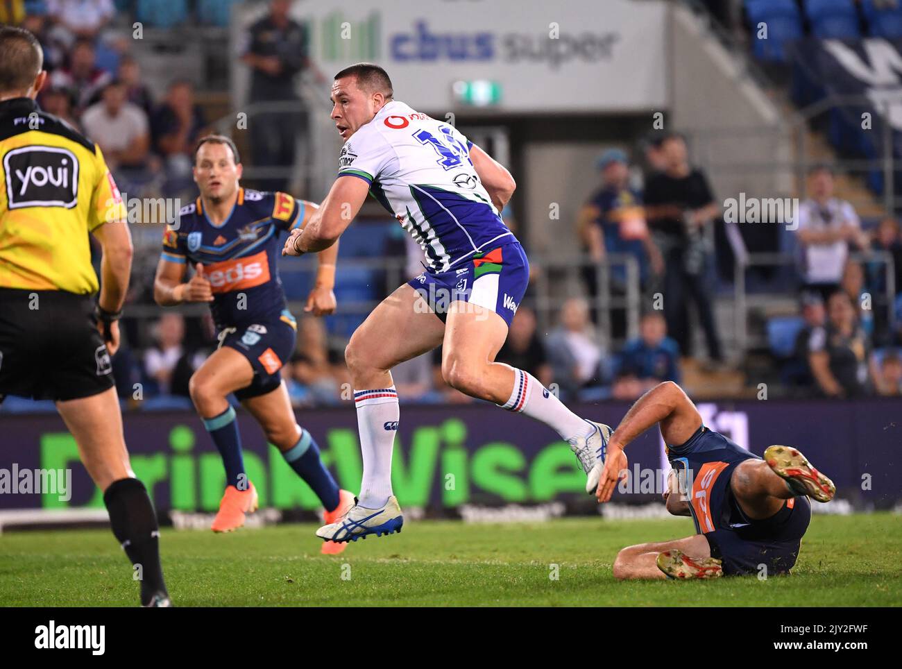 Lachlan Burr of the Warriors skips out of a tackle during the Round 14 ...
