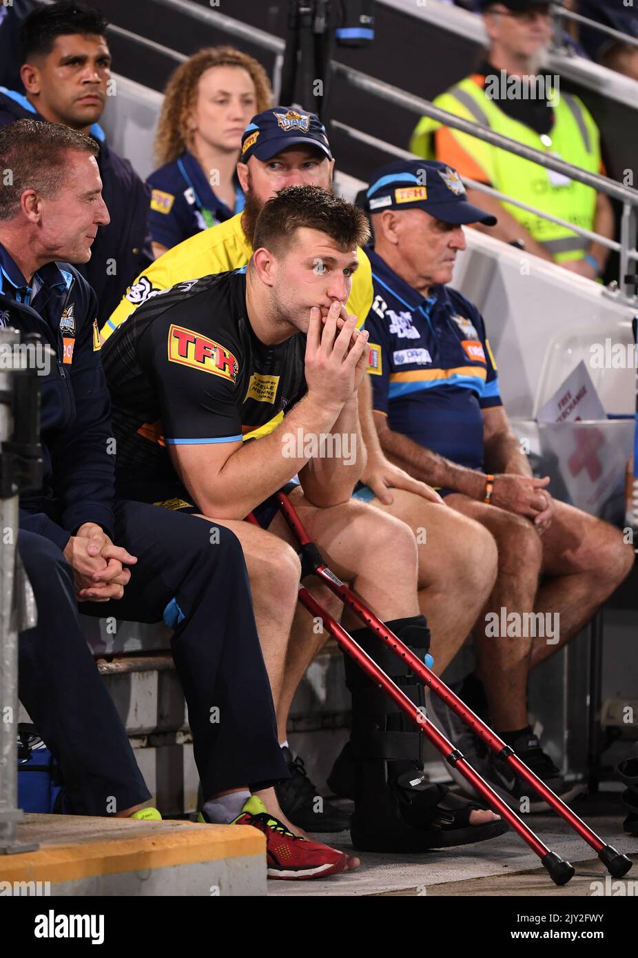 Jai Arrow of the Titans sits injured during the Round 14 NRL match ...