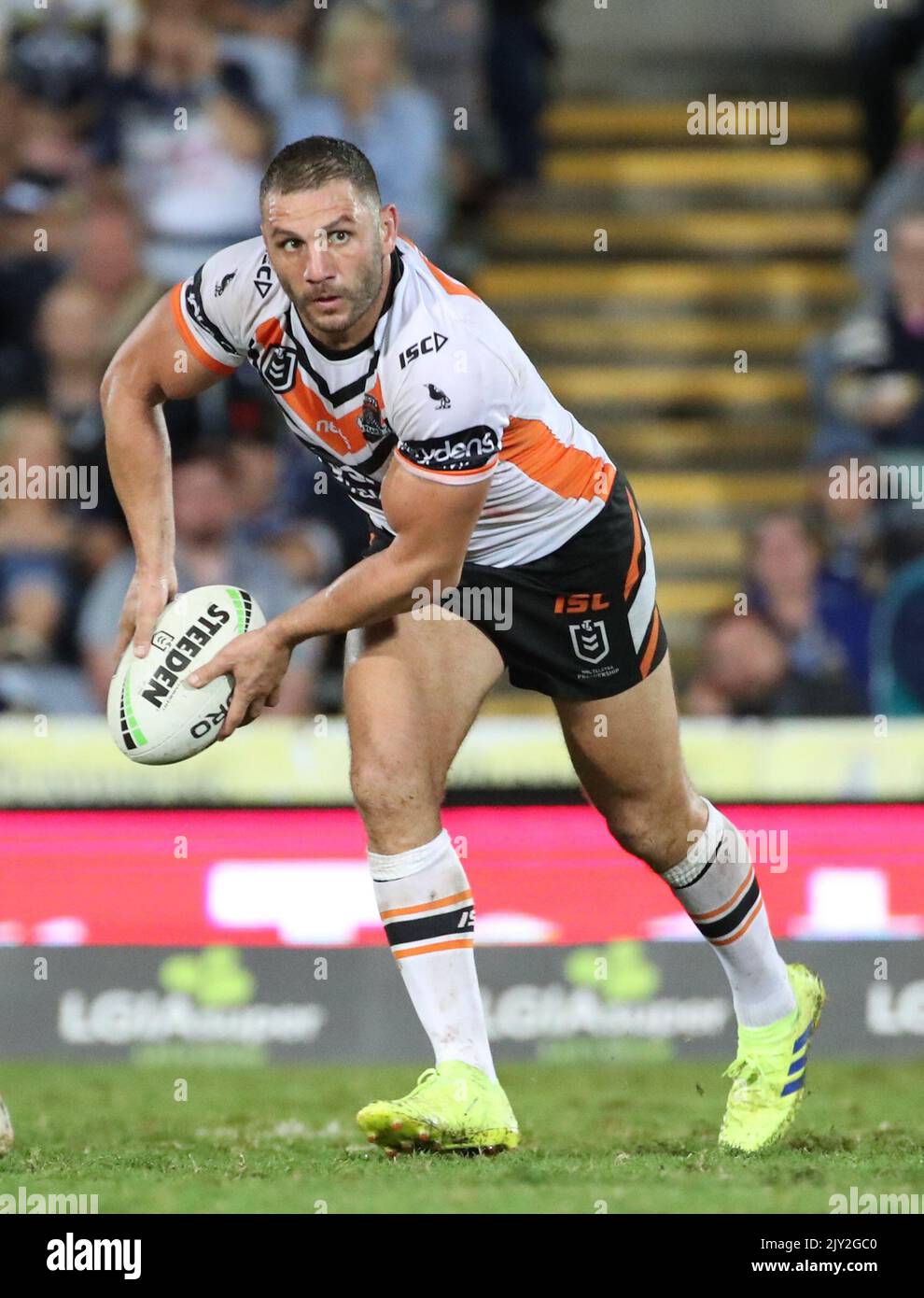 Robbie Farah of the Tigers looks to pass the ball during the Round 14 ...
