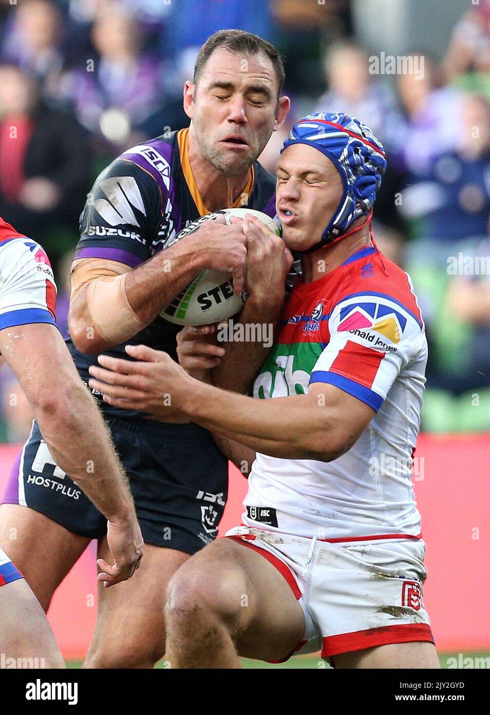 Cameron Smith of the Storm (left) contests with Kalyn Ponga of the ...