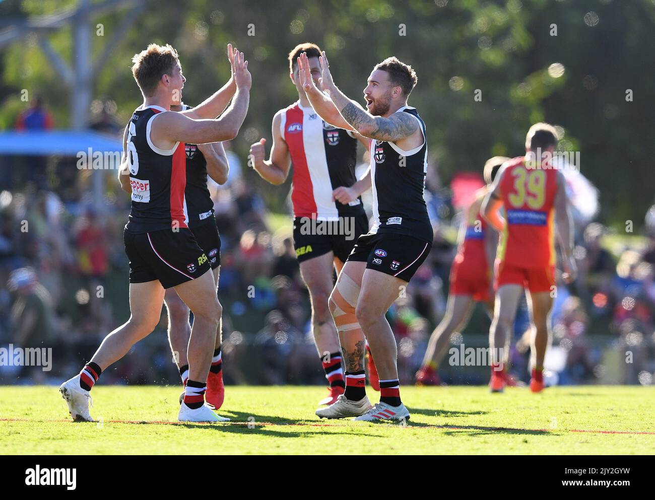 Dean Kent of the Saints (right) celebrates scoring a goal during the ...