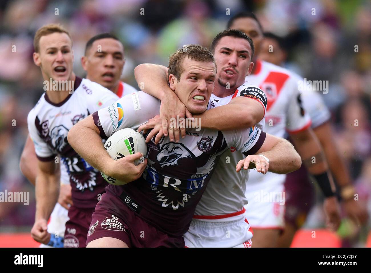 Reece Robson of the Dragons tackles Jake Trbojevic of the Sea Eagles ...