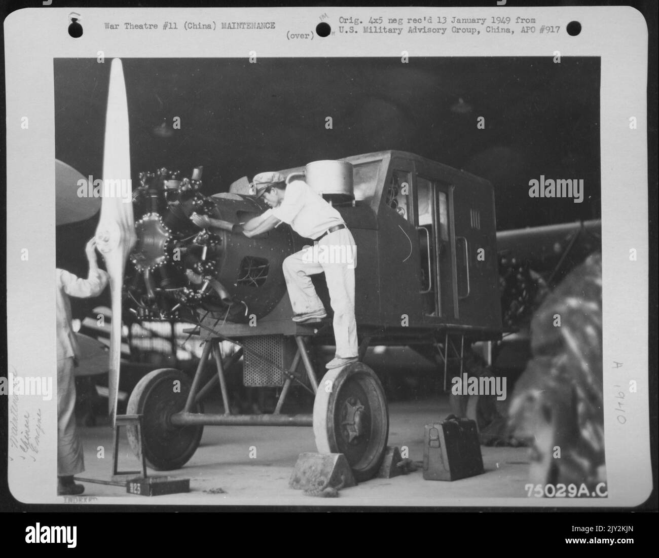 Chinese Personnel Work On An Airplane Engine Installed In A Training ...