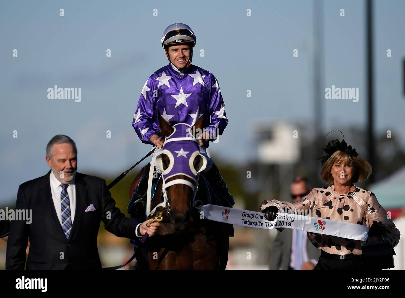 Jockey Jason Collett returns to the mounting yard after riding ...