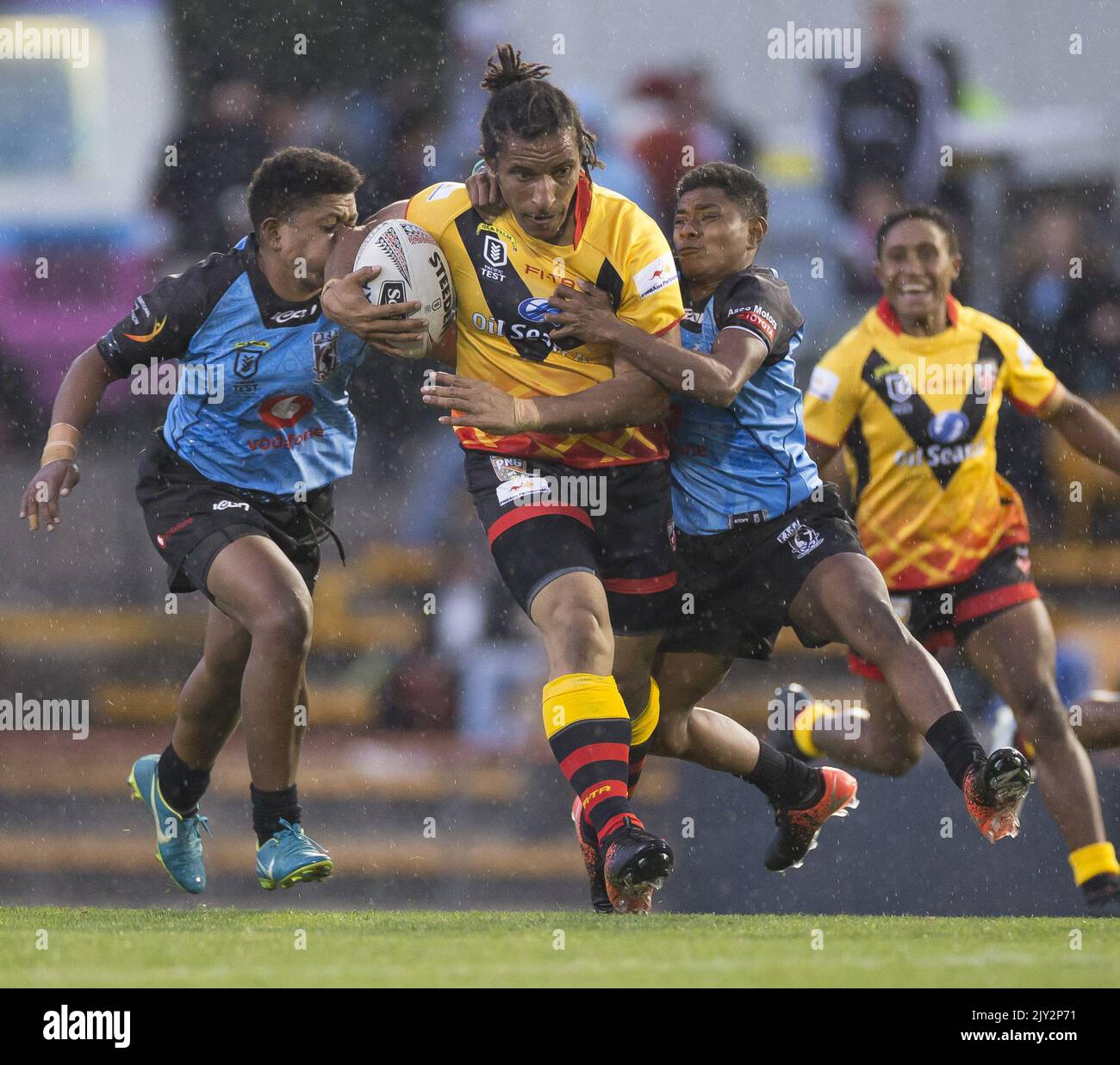 Elsie Albert of PNG is tackled during the Pacific Test Invitational ...