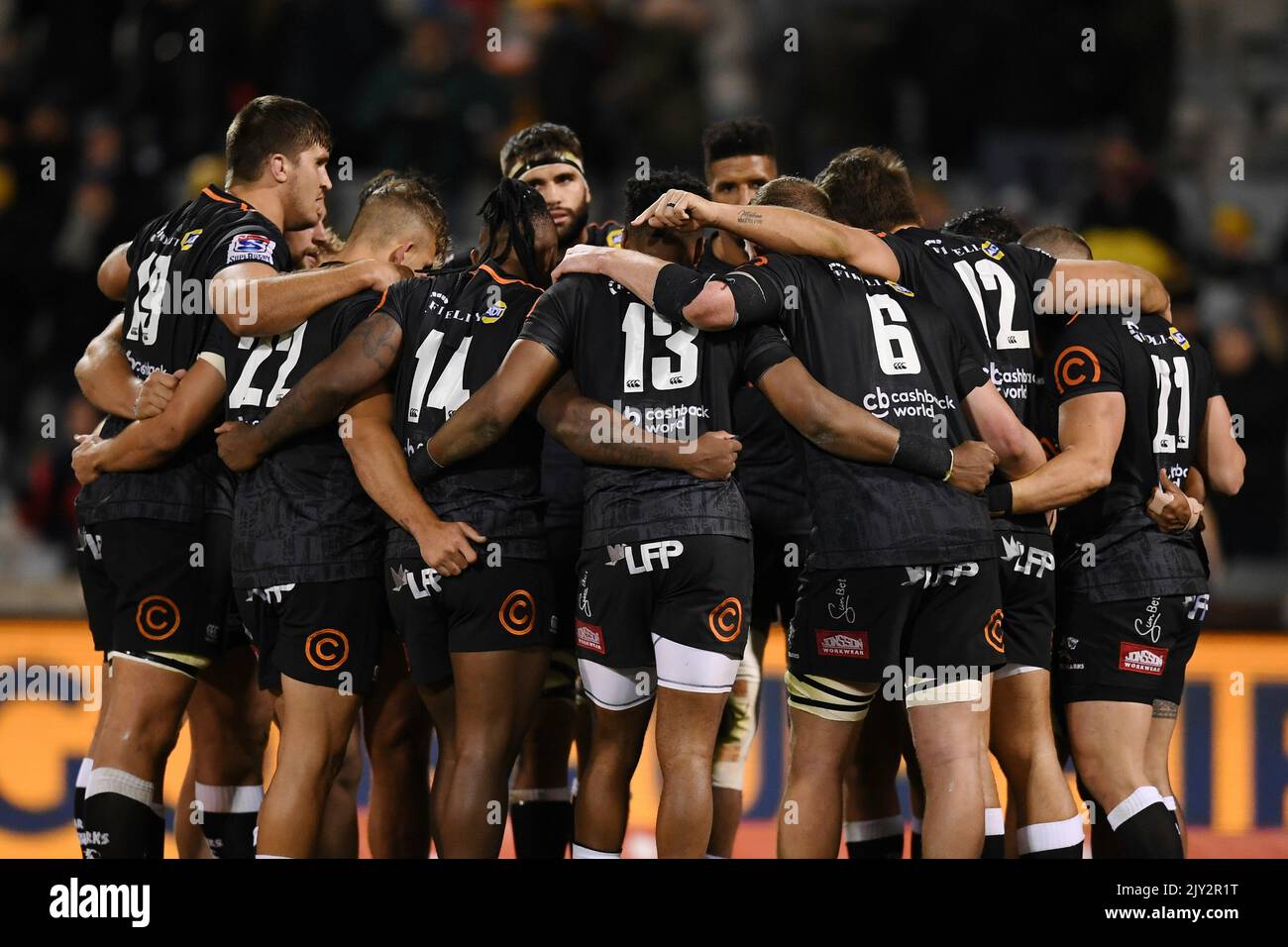 Sharks players stand together after loosing the Super Rugby quarter ...