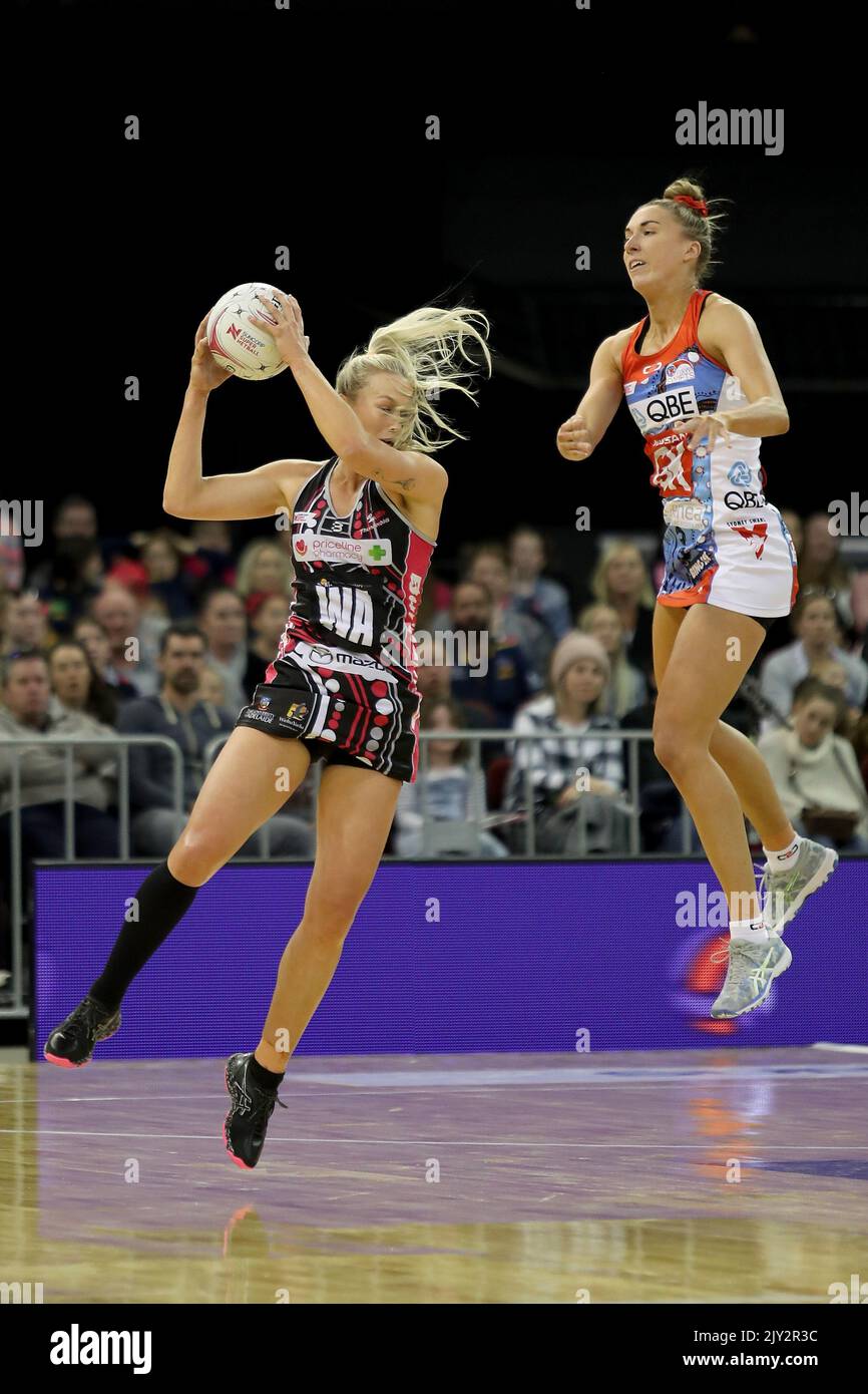 Chelsea Pitman of the Thunderbirds competes with Sarah Klau of the ...