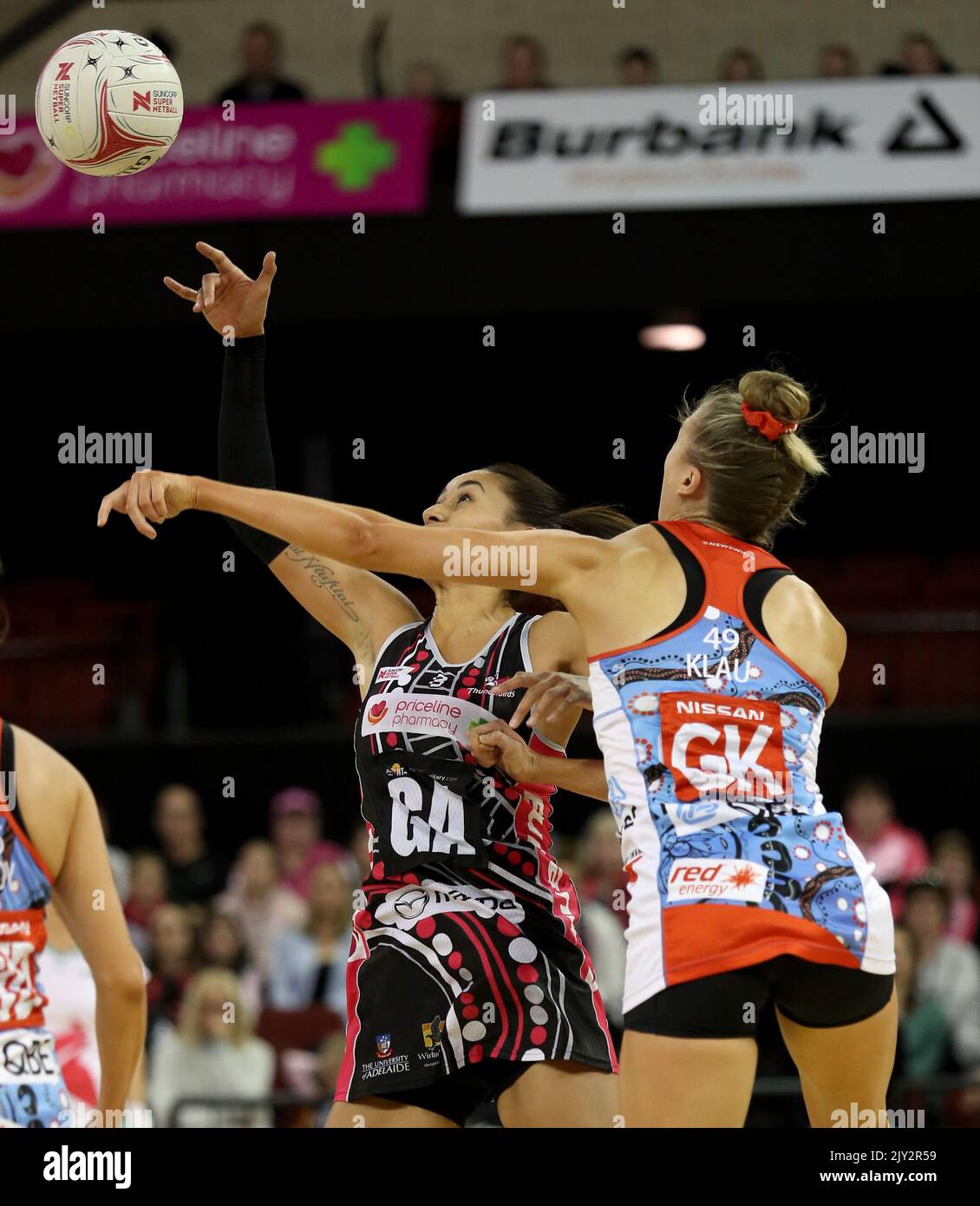 Maria Folau of the Thunderbirds competes with Sarah Klau of the Swifts ...