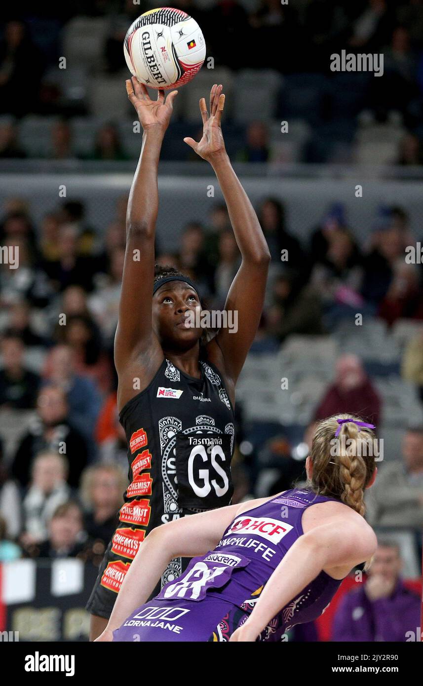 Shimona Nelson of the Magpies (top) shoots under pressure from Tara ...