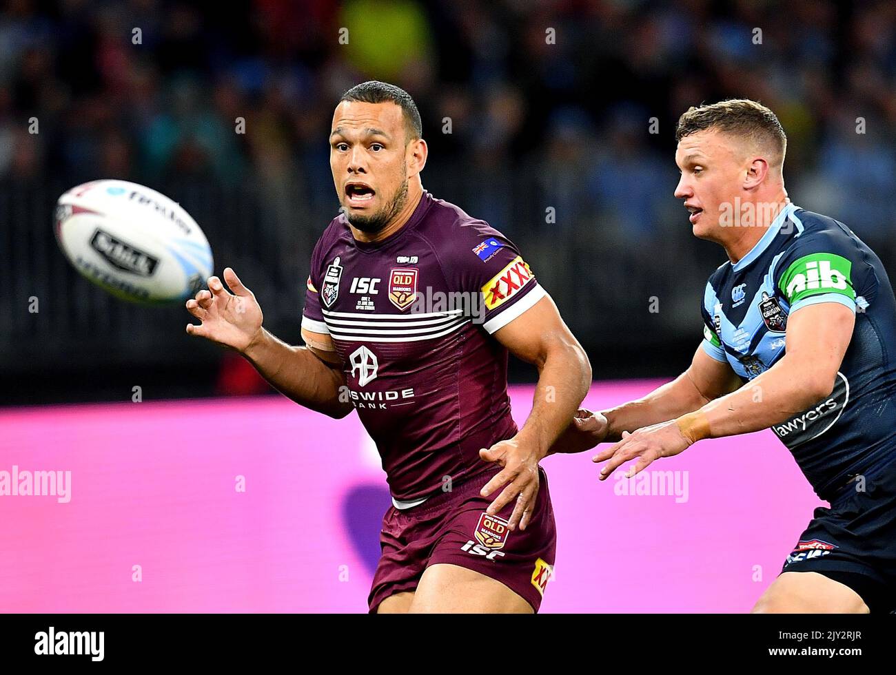 Will Chambers (left) of the Maroons fails to get to the ball over the ...