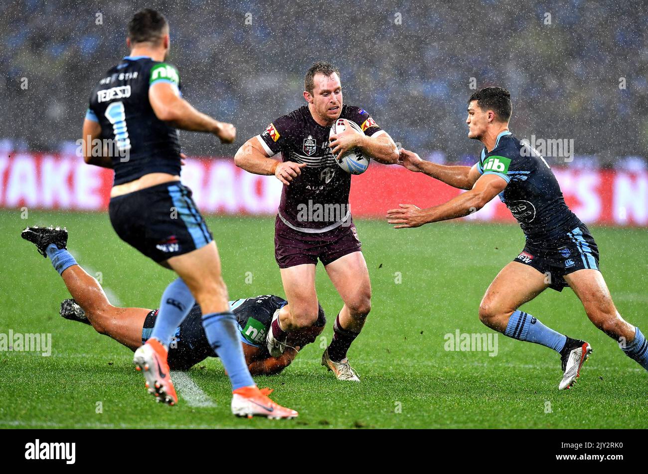 Michael Morgan (centre) of the Maroons in action during Game 2 of the ...