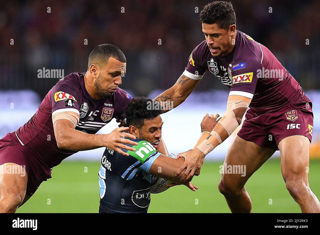 Josh Addo-Carr of the Blues is tackled by Will Chambers (left) and Dane ...
