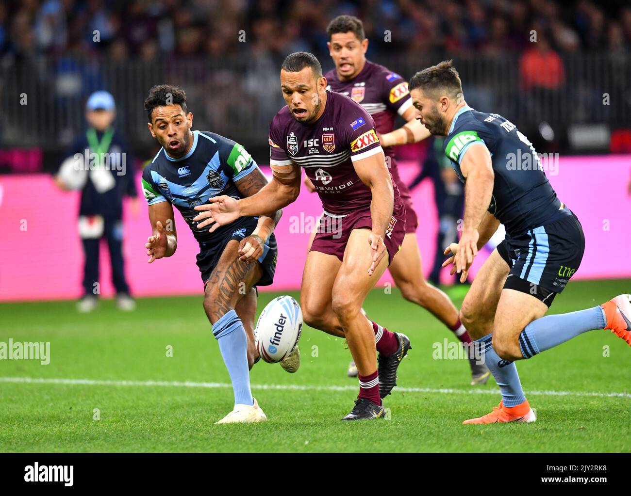 Will Chambers (centre) of the Maroons fails to get to the ball over the ...