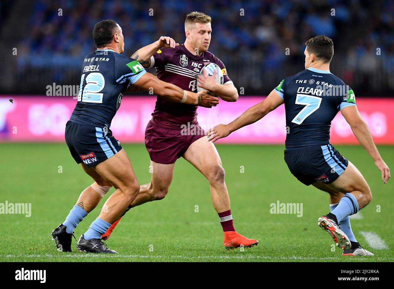 Cameron Munster (centre) of the Maroons in action during Game 2 of the ...